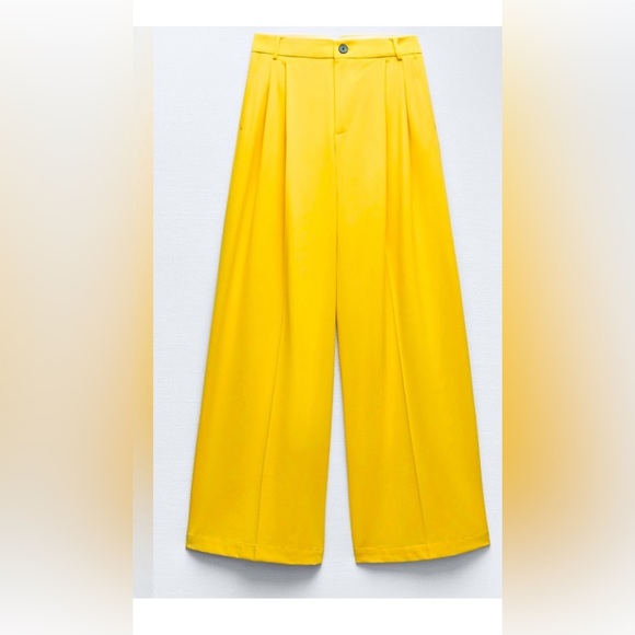 Zara | Pants & Jumpsuits | Zara Yellow Pleated Pants With Black Button ...